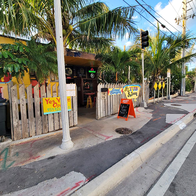 The unassuming entrance to burger paradise. Like finding a pirate's treasure map disguised as a fence, Le Tub's weathered exterior hides culinary gold within.