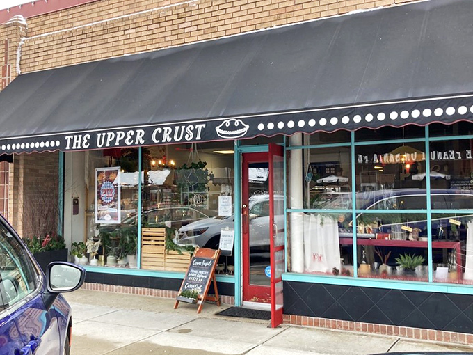 The unassuming storefront of The Upper Crust hides culinary treasures that would make any dessert detective's career. The black awning and brick fa&ccedil;ade promise old-school authenticity. 