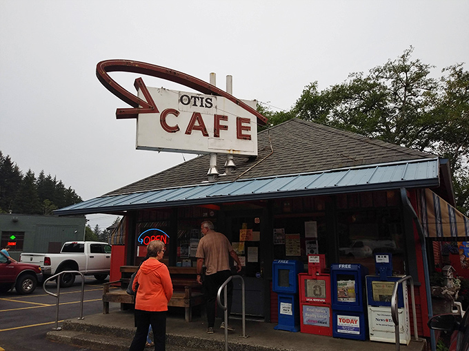 The iconic red exterior of Otis Cafe stands like a beacon of hope for hungry travelers along Highway 18, promising comfort food salvation just minutes from Lincoln City.