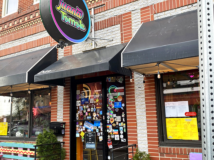 The colorful storefront of Juana Tamale beckons like a fiesta waiting to happen. Mexican flags and vibrant signage promise authentic flavors on East Passyunk Avenue.