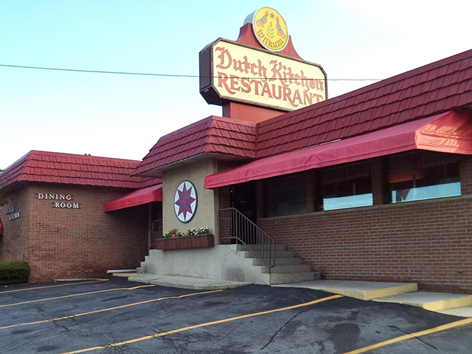 The red-roofed sanctuary of comfort food stands proudly on Route 61, its vintage sign and hex symbol beckoning hungry travelers like a Pennsylvania Dutch lighthouse.