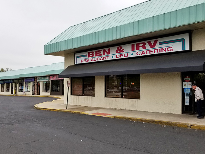 The unassuming exterior of Ben & Irv's hides culinary treasures within. That teal roof has sheltered sandwich seekers for generations. 
