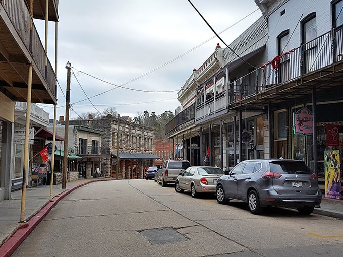 The Flatiron Building of the Ozarks stands proudly at this impossible intersection, defying gravity and common sense with Victorian flair.