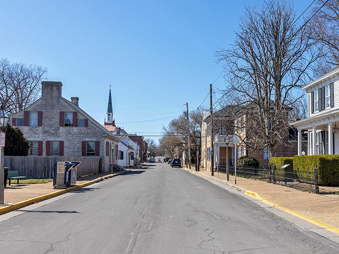 The historic Hotel Ste. Genevieve stands as a red brick sentinel to the past, welcoming visitors with its wraparound porch and promise of stories within.