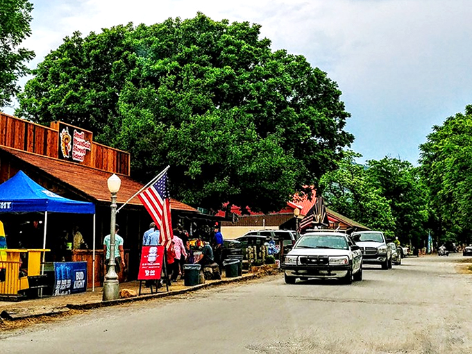 Main Street charm on full display! Medicine Park's cobblestone buildings and American flags create that perfect small-town vibe that makes you want to linger all afternoon.