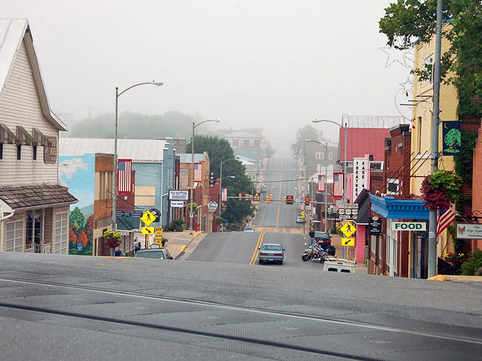 Main Street stretches before you like a Norman Rockwell painting come to life, brick buildings standing proud against the Blue Ridge backdrop.