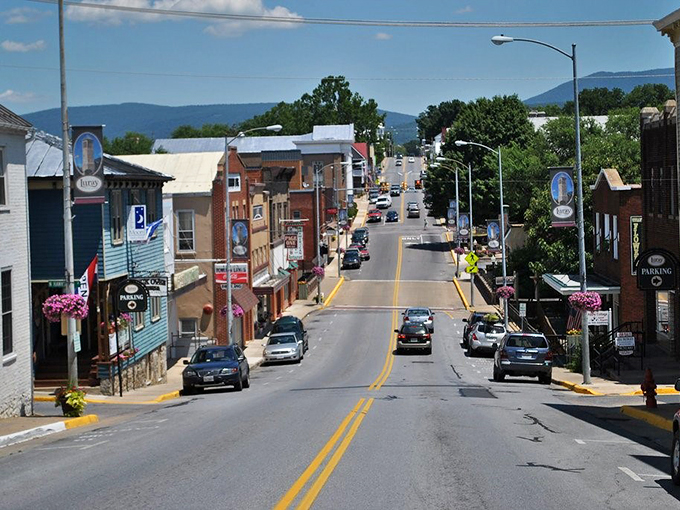 Main Street stretches before you like a Norman Rockwell painting come to life, brick buildings standing proud against the Blue Ridge backdrop.
