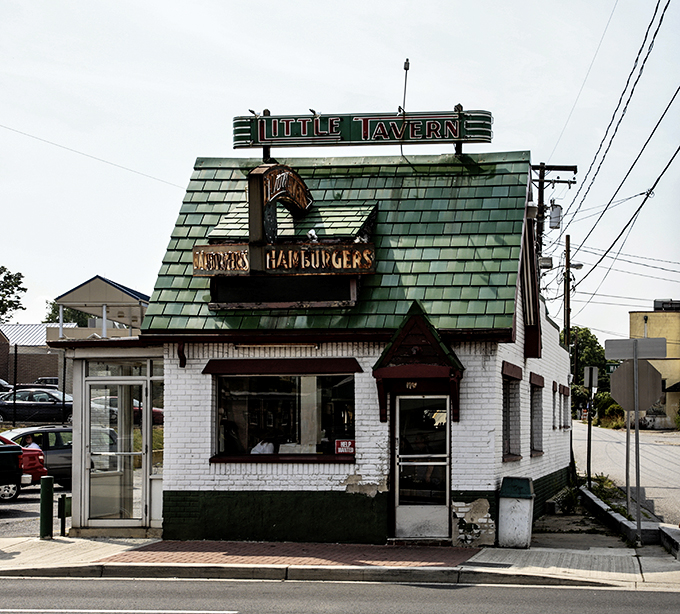 The little green-roofed donut shop that could! Laurel Tavern Donuts stands like a delicious time capsule on Washington Boulevard, beckoning sweet-toothed travelers.