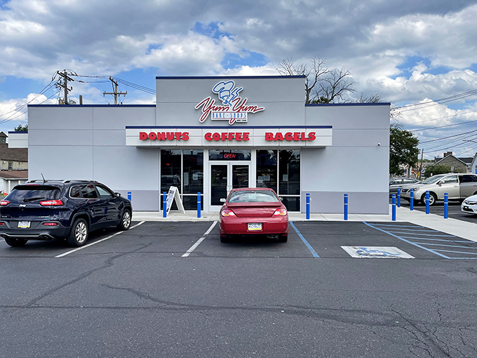 The modest white exterior of Yum Yum Bake Shop belies the sweet treasures within. No architectural frills, just a singular focus on donut perfection.