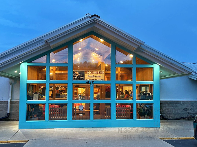 The teal-framed A-frame entrance isn't just inviting&mdash;it's practically winking at you to come inside for a catfish adventure.