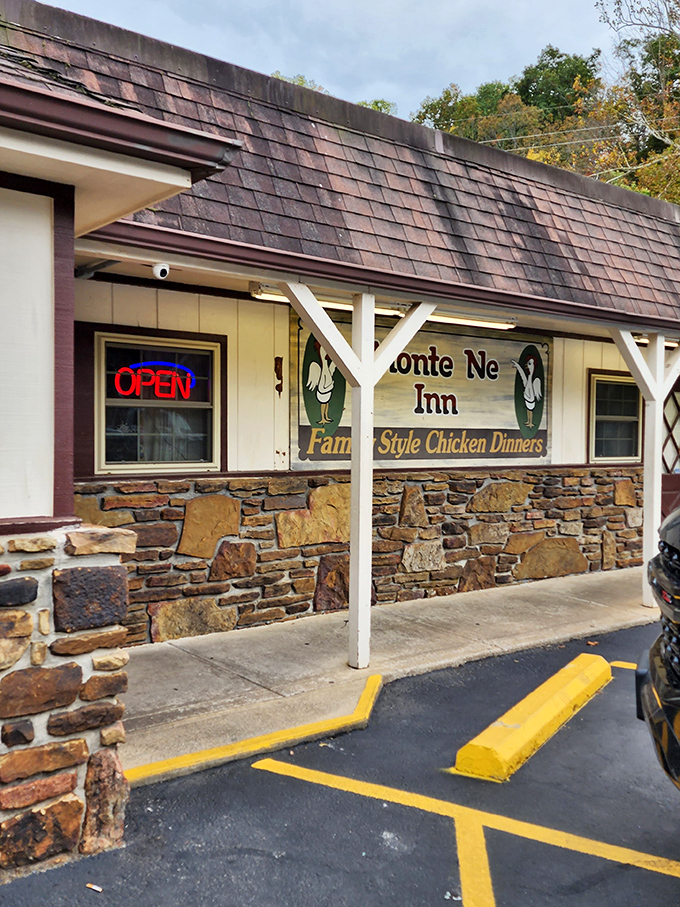 The iconic Monte Ne Inn sign promises "Family Style Chicken Dinners" with cartoon chickens that seem to know they're deliciously doomed. Arkansas comfort food at its finest.