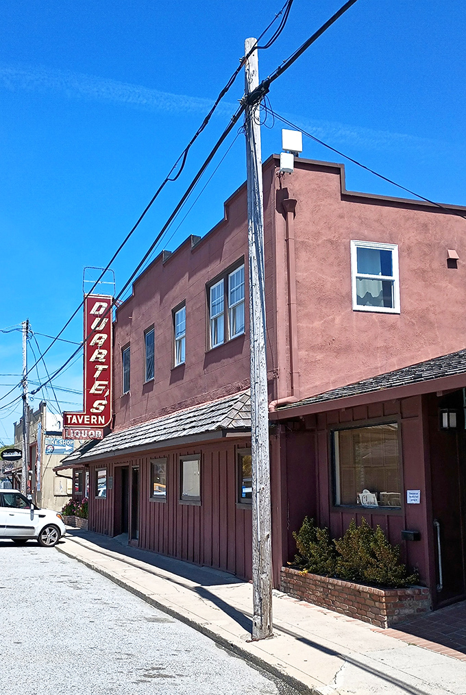 The iconic rose-colored exterior of Duarte's Tavern stands like a culinary lighthouse on Pescadero's main drag, beckoning hungry travelers since 1894.