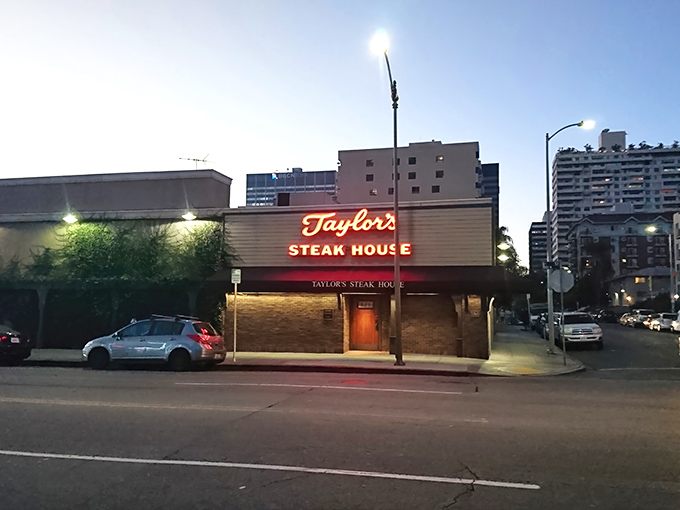 The unassuming brick facade of Taylor's Steak House stands like a culinary speakeasy, promising carnivorous delights behind its modest exterior.