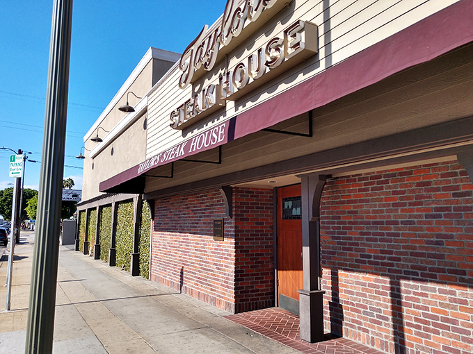 The unassuming brick facade of Taylor's Steak House stands like a culinary speakeasy, promising carnivorous delights behind its modest exterior.
