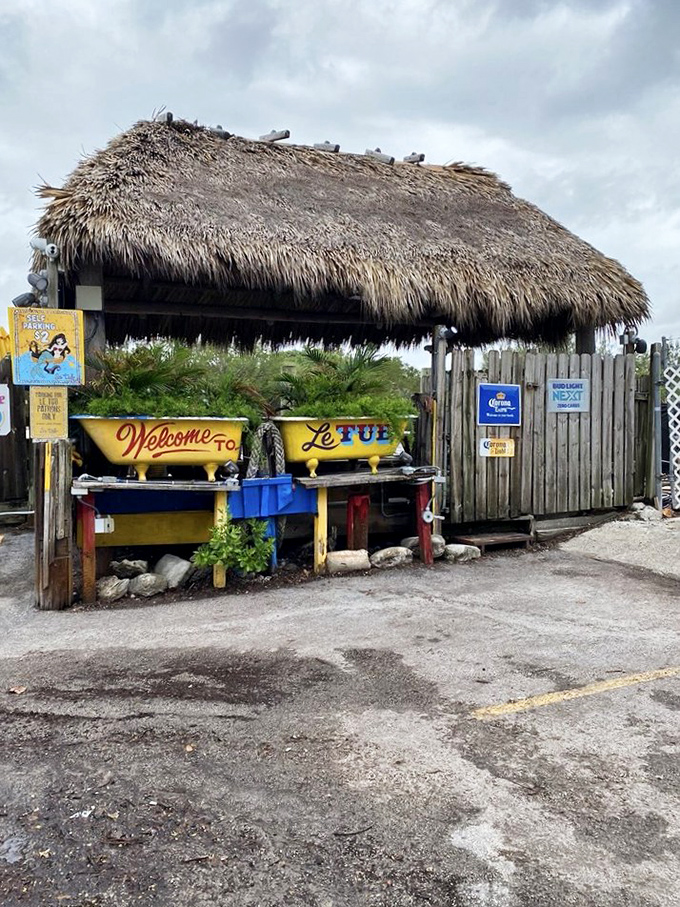 The unassuming entrance to burger paradise. Like finding a pirate's treasure map disguised as a fence, Le Tub's weathered exterior hides culinary gold within.