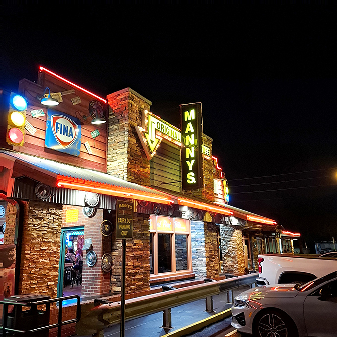 The neon-lit exterior of Manny's Original Chophouse stands like a beacon for carnivores, promising "LOVE at First Bite" beneath its iconic signage. 