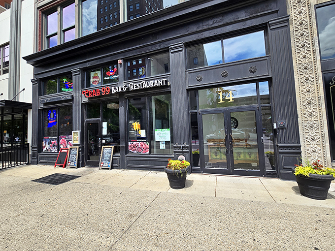 The neon glow of Crab 99's sign cuts through the night like a lighthouse for seafood-starved Midwesterners, promising oceanic treasures in downtown Indy.