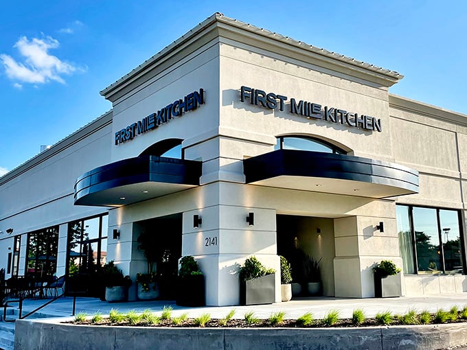 First Mile Kitchen's illuminated sign beckons hungry travelers like a culinary lighthouse in Wichita's Bradley Fair shopping district.