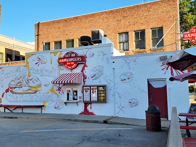 The unassuming white exterior of Cozy Inn belies its legendary status. Like finding a Picasso at a yard sale, this humble building houses burger greatness.