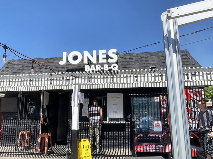 The unassuming black exterior of Jones Bar-B-Q speaks volumes: great barbecue doesn't need fancy digs, just smoke, skill, and soul. 