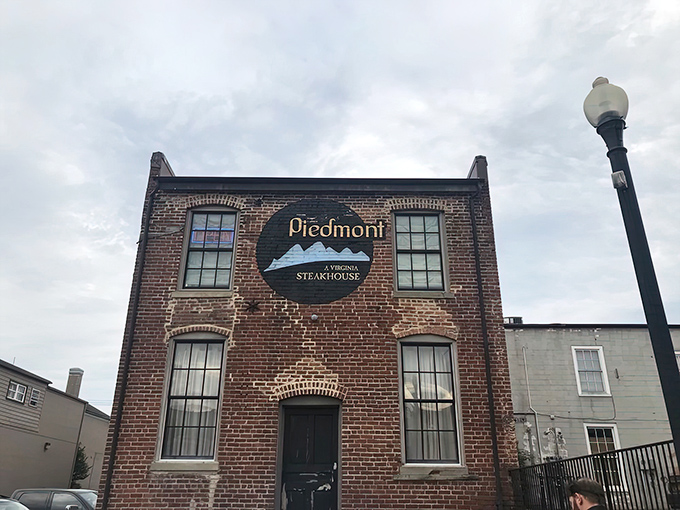 The historic brick facade of Piedmont Steakhouse stands as a testament to Kansas culinary heritage, promising hearty meals within its unassuming walls.