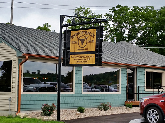 The unassuming seafoam green exterior of Metropolitan Steakhouse stands like a culinary speakeasy &ndash; modest on the outside, magnificent on the inside.