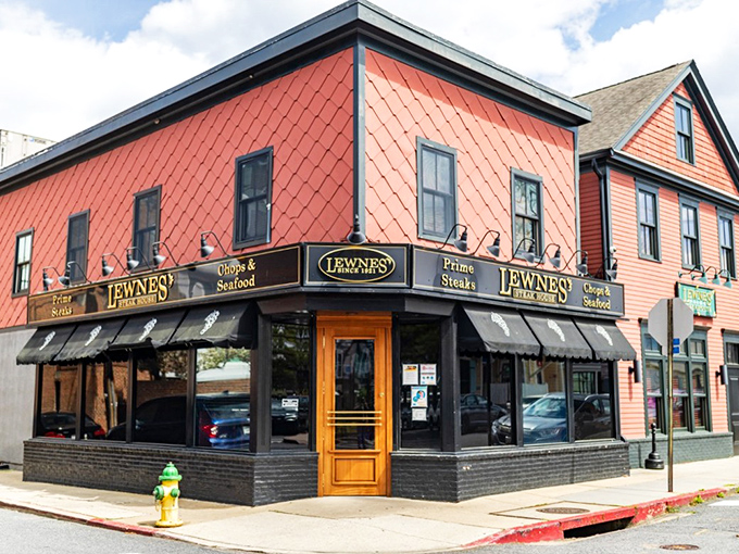 The unassuming exterior of Lewnes' Steakhouse in Annapolis hides a carnivore's paradise within. Classic diamond-patterned shingles and vintage awnings signal you've found the real deal.