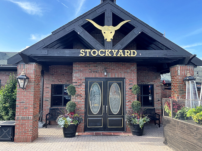 The grand entrance beckons with its iconic golden longhorn skull, promising carnivorous delights within those brick walls. Massachusetts hospitality with a Texas accent.