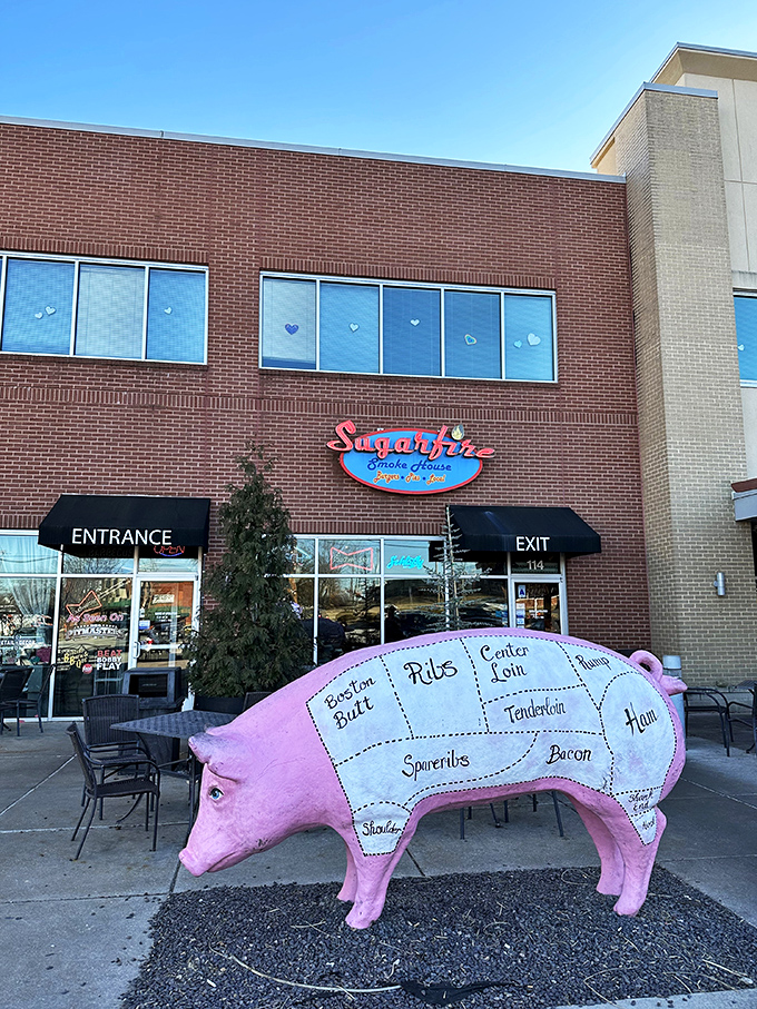 The brick-and-mortar temple of smoke beckons with its cheerful blue sign and red neon "BARBECUE" promise&mdash;a siren call to hungry travelers.