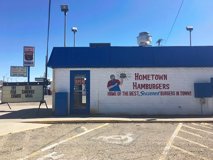 The blue-roofed burger sanctuary beckons with its no-nonsense promise: "Home of the best, seasoned burgers in town." No argument here.