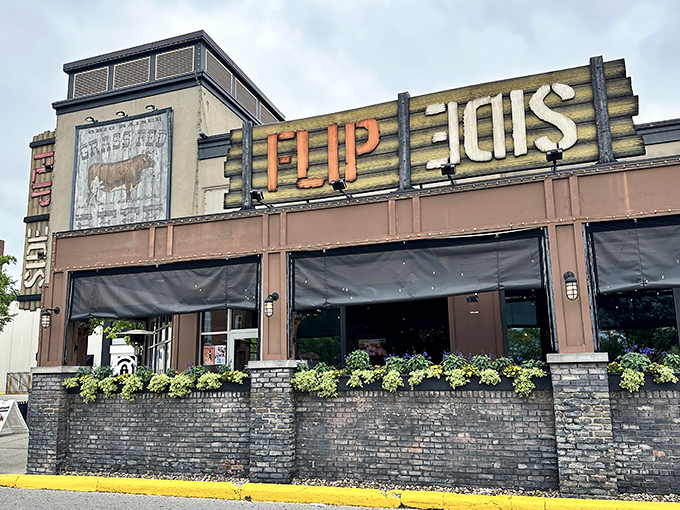 The wooden "FLIP SIDE" sign beckons like a lighthouse for the burger-obsessed. Those flower boxes aren't just pretty&mdash;they're a promise of good things to come.