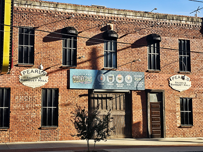 The iconic red neon "CRATOWN" sign beckons hungry travelers like a lighthouse for landlocked seafood lovers in Oklahoma City's Bricktown district. 