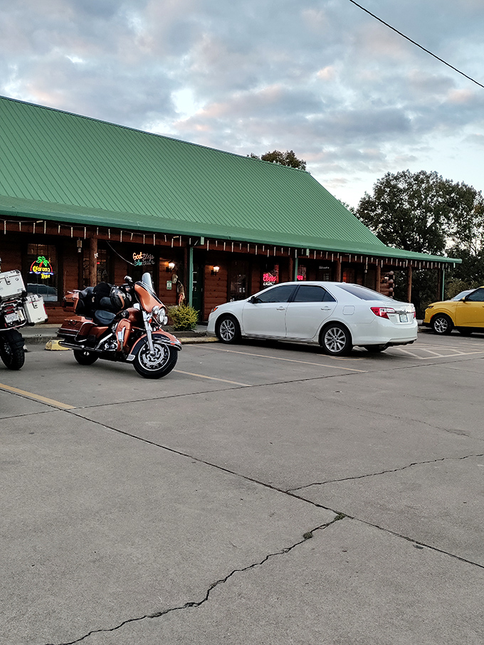 The rustic log cabin exterior invites you in with its homey charm, string lights, and green door&mdash;like a woodland retreat that happens to serve incredible steaks. 