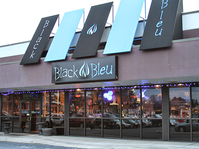 The blue glow of Black n Bleu's facade beckons hungry travelers like a culinary lighthouse in Mechanicsburg's evening landscape.
