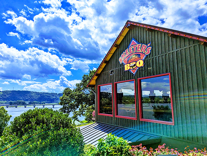 Skeeter's green exterior glows at dusk like a barbecue beacon, calling hungry travelers home with its rustic charm and promise of smoky delights.