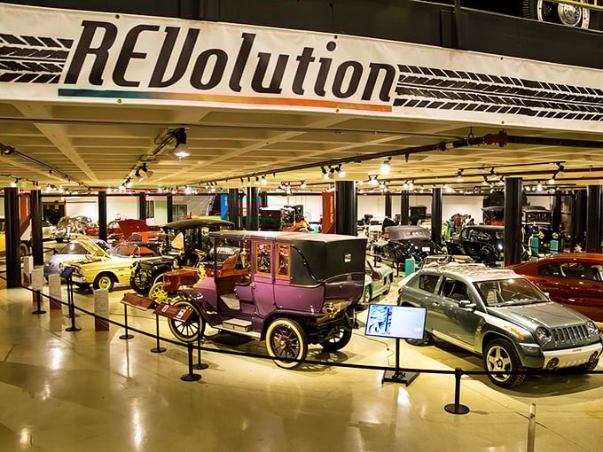 The "REVolution" exhibit showcases automotive history's greatest hits, from horseless carriages to modern marvels, all under one spectacularly lit roof.
