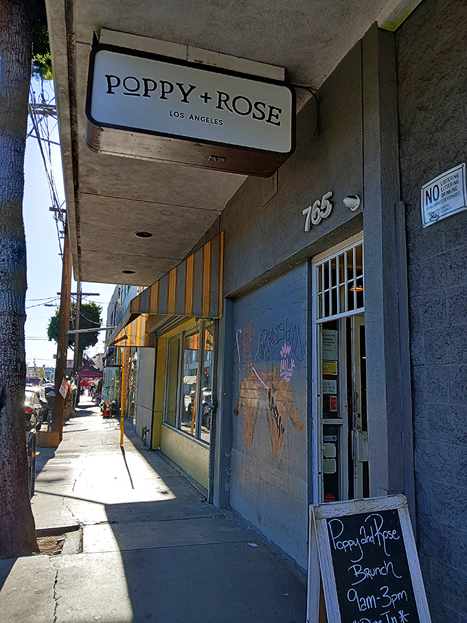 The sunshine-yellow exterior of Poppy + Rose beckons like a culinary lighthouse amid downtown LA's Flower District, promising comfort food worth the journey.