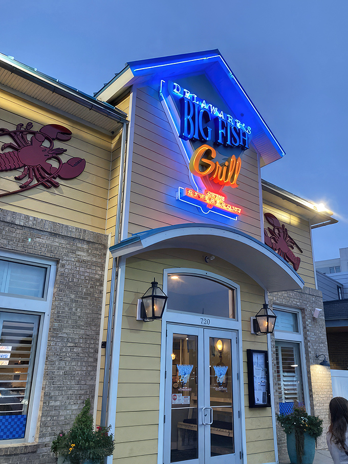 The cheerful yellow exterior of Big Fish Grill beckons like a maritime lighthouse for hungry souls. Blue accents and nautical touches promise seafood salvation ahead.