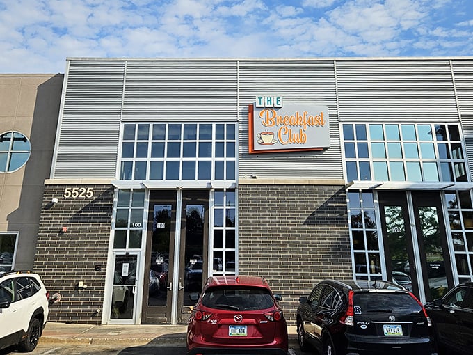 The turquoise-framed sign against rustic brick promises a breakfast revolution hiding behind that unassuming door at 212 East 3rd Street.