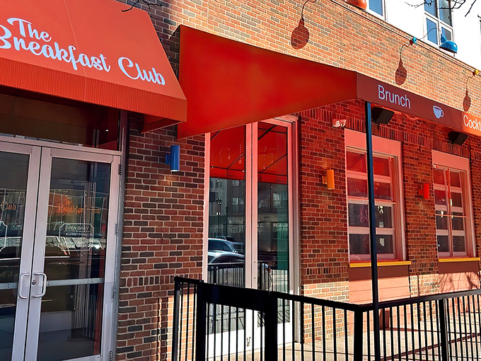 The vibrant red awning of The Breakfast Club MPLS beckons breakfast enthusiasts like a culinary lighthouse guiding hungry souls through Minneapolis mornings.