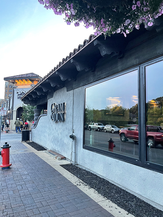 The Spanish-inspired fa&ccedil;ade of Gram & Dun welcomes hungry pilgrims to Kansas City's Country Club Plaza, where culinary magic awaits behind those elegant windows.