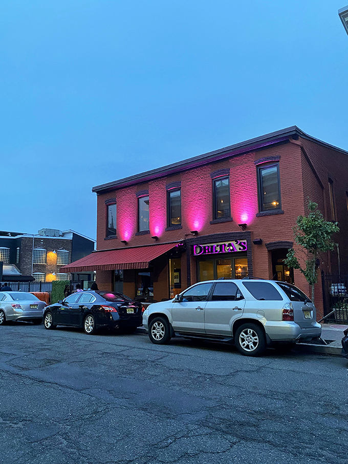 Delta's distinctive brick facade glows with promise at dusk, like a Southern lighthouse beckoning hungry travelers to safe harbor.