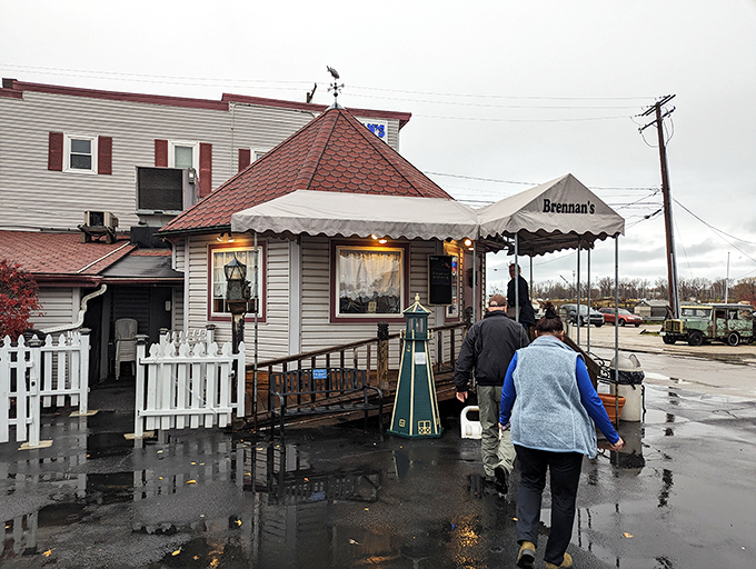 The unassuming white clapboard exterior of Brennan's Fish House stands like a beacon for seafood lovers, its distinctive red-shingled roof a landmark in Grand River