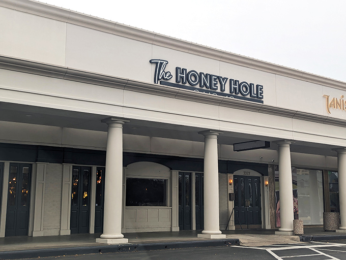 The unassuming storefront belies the culinary treasures within. Like finding a secret speakeasy, but instead of bootleg whiskey, you get life-changing shrimp and grits.