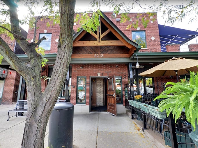The brick facade of Aristocrat Pub welcomes you like an old friend, complete with wooden gable entrance and lush hanging ferns creating instant curb appeal.
