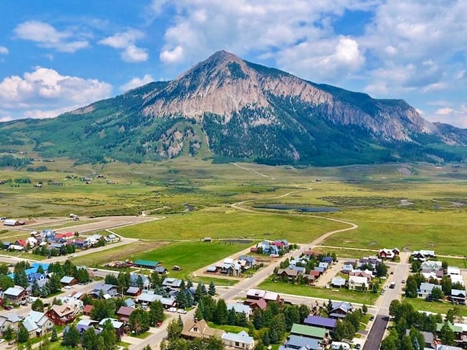 Elk Avenue stretches toward mountain majesty like a Western movie set come to life. Victorian charm meets rugged peaks in perfect harmony.