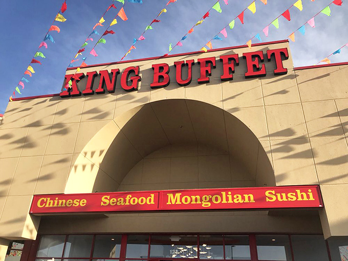 Festive bunting dances above King Buffet's entrance, like colorful flags announcing an international food Olympics where everyone gets a gold medal in eating.