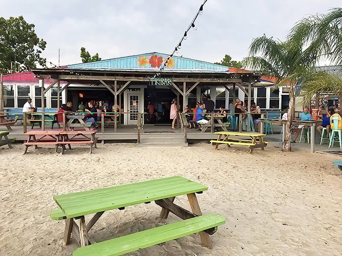 Rainbow-colored picnic tables create a beachside paradise where your toes can wiggle in the sand while your taste buds dance with delight.