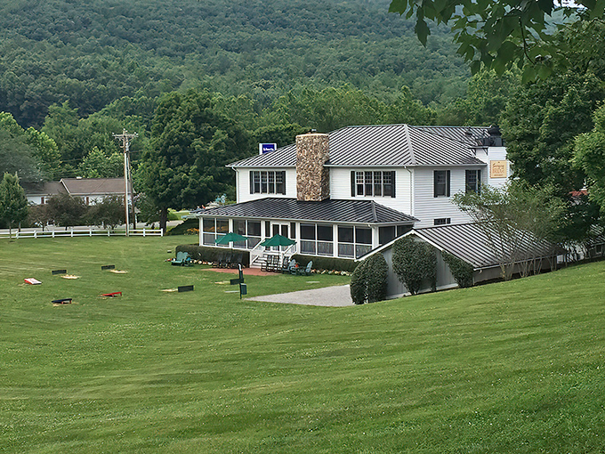 The Swinging Bridge Restaurant stands like a postcard come to life, with autumn-painted mountains creating the perfect backdrop for culinary adventures ahead.