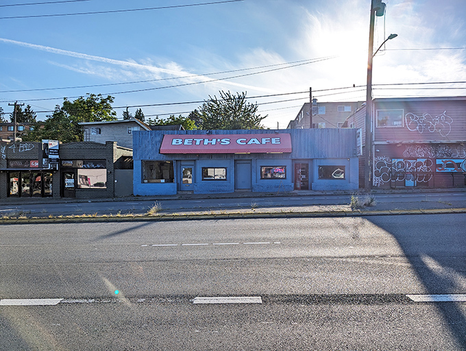 The iconic blue exterior with its bright red awning has been beckoning hungry Seattleites for generations, like a breakfast lighthouse in a sea of ordinary restaurants. 